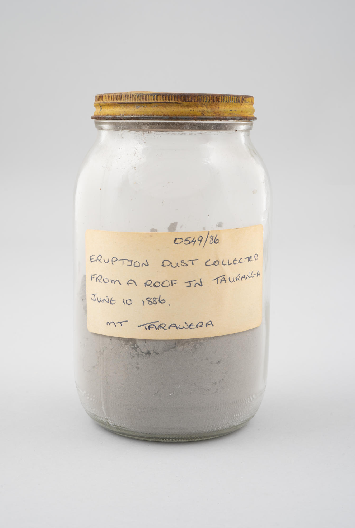 Tarawera eruption ash in jar - Tauranga Heritage Collection